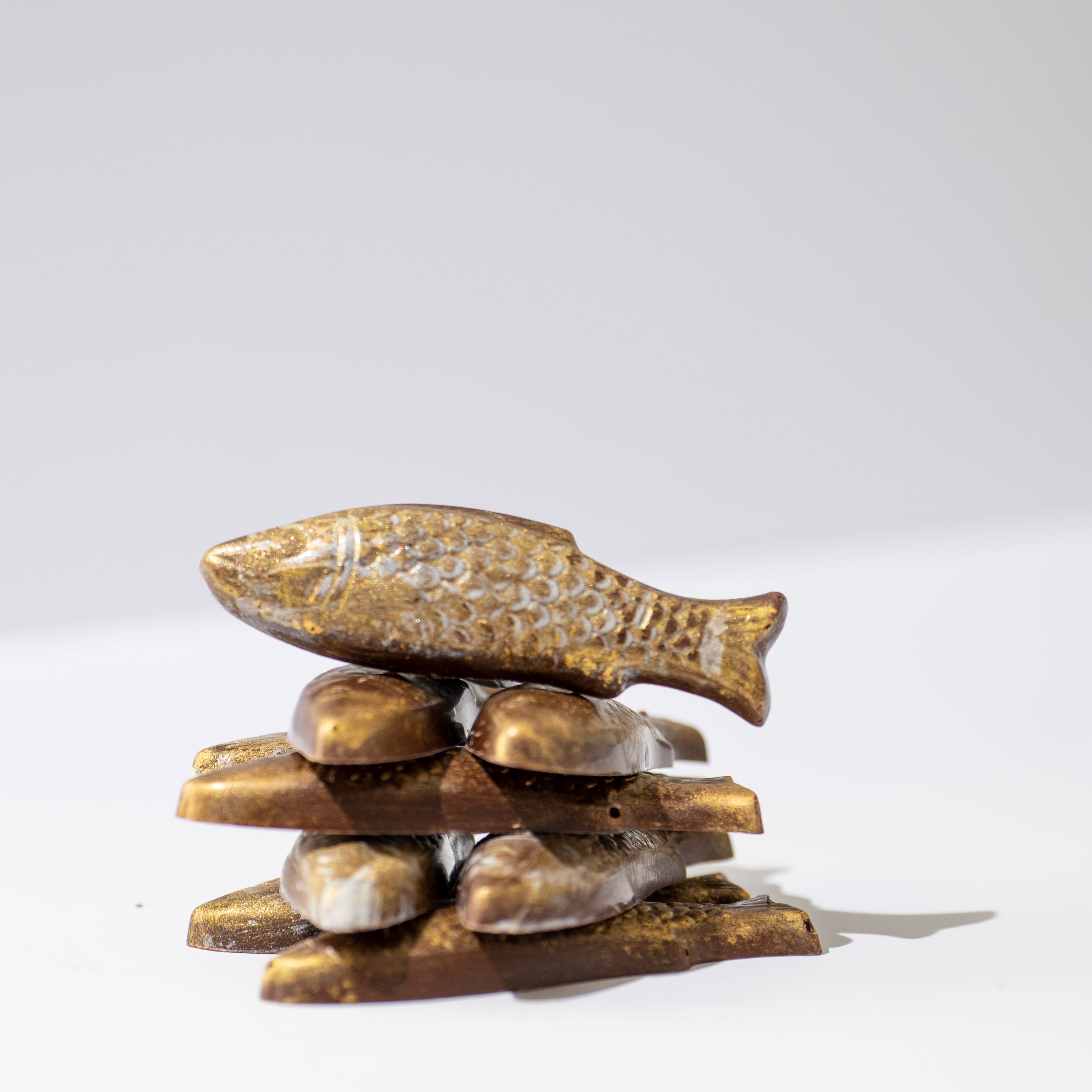 Dark and milk chocolate fish with natural gold and silver decoration ...